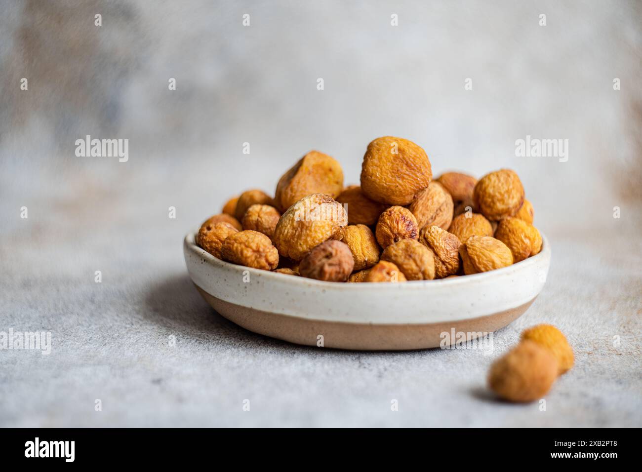 A bowl filled with Arashan Kandak, a type of sun-dried apricot from ...
