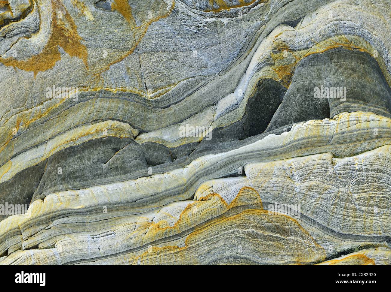 Close-up image of layered slate and quartzite rock formations ...