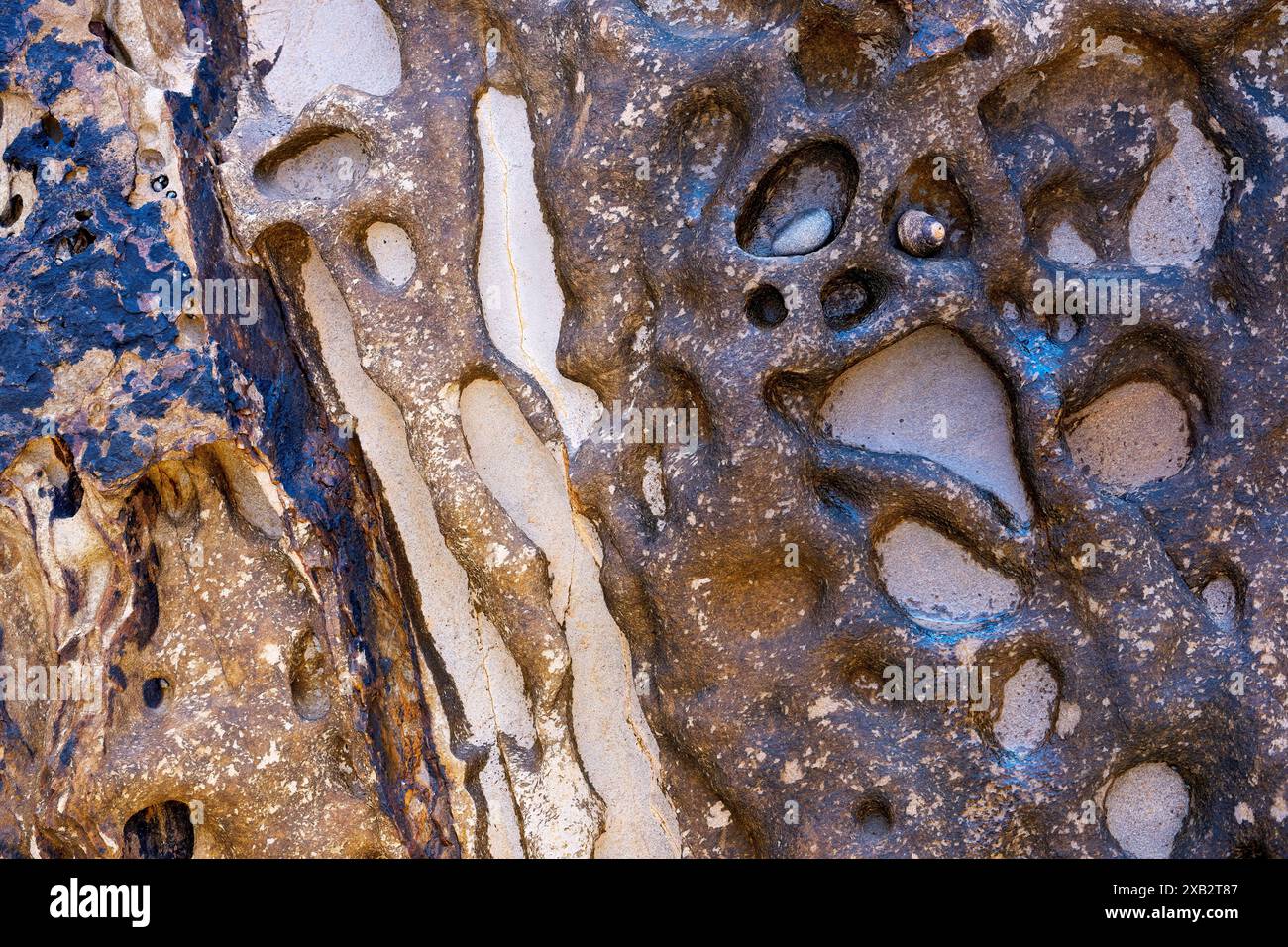 A detailed close-up of fineart rock surfaces revealing abstract ...