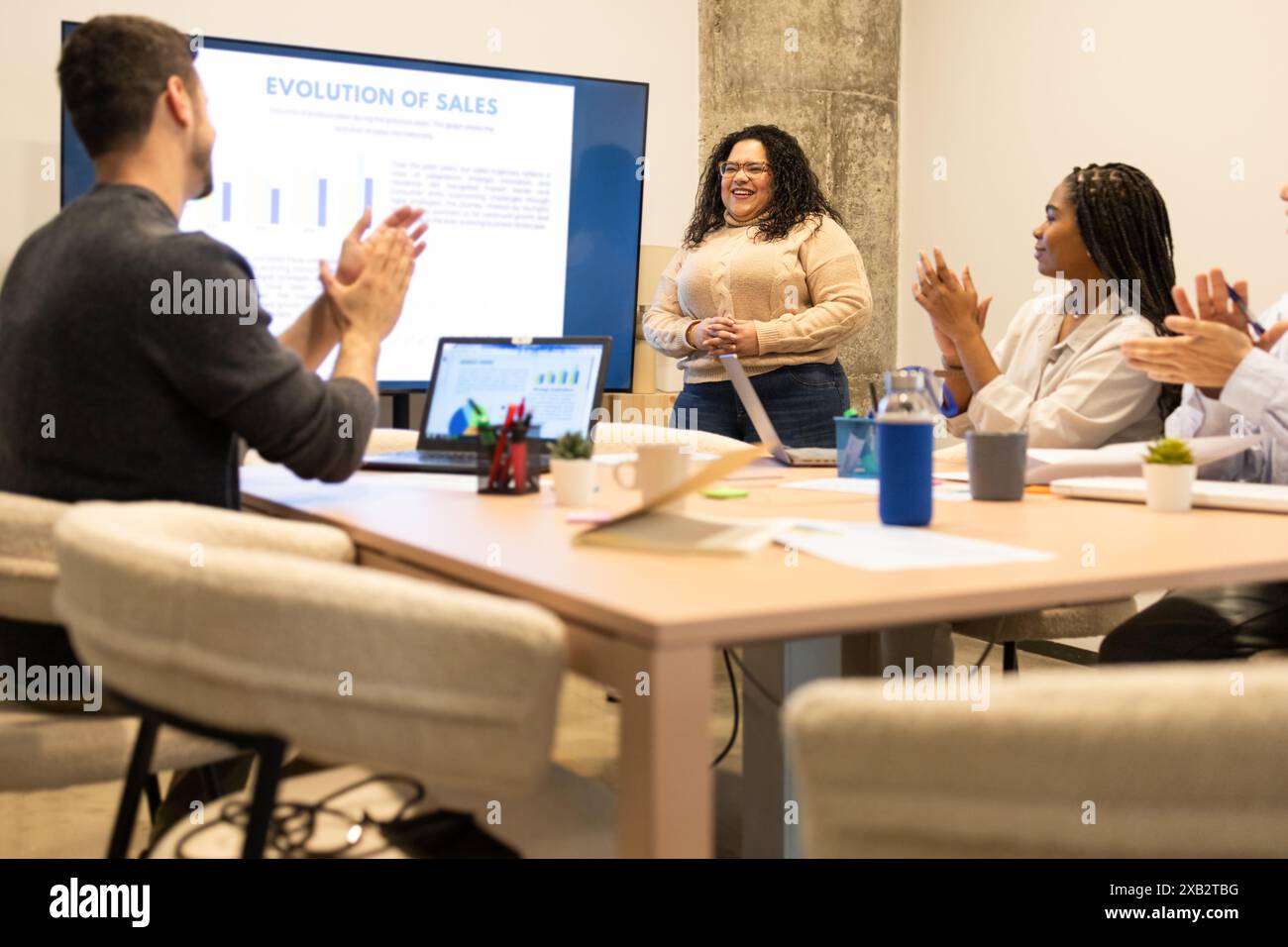 A diverse team of colleagues collaborates in a coworking space ...