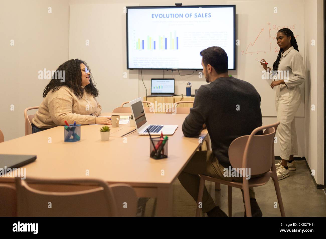Diverse group of friends collaborating in a modern coworking space ...