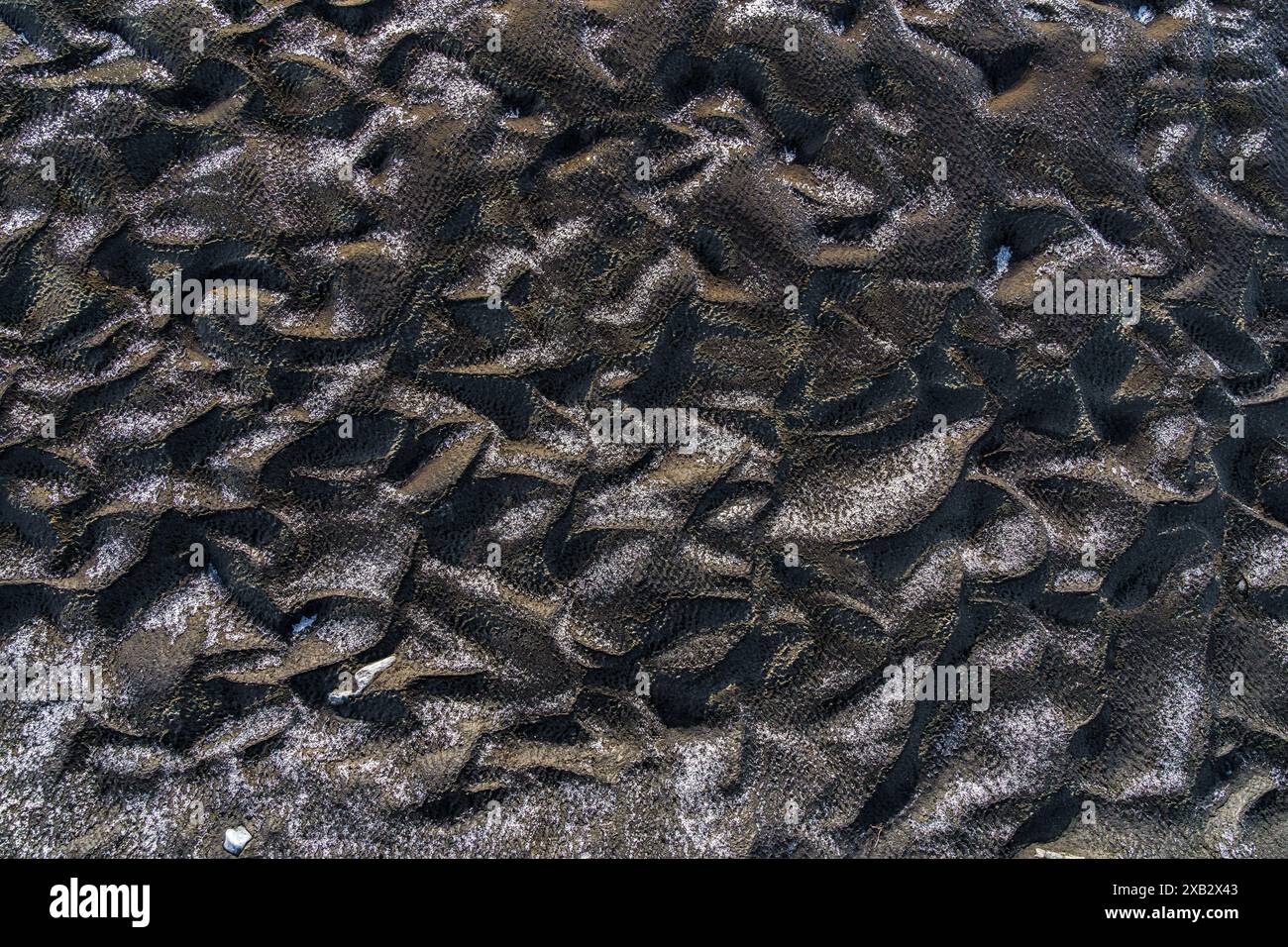 Aerial view showcasing intricate sand textures in a highland area ...