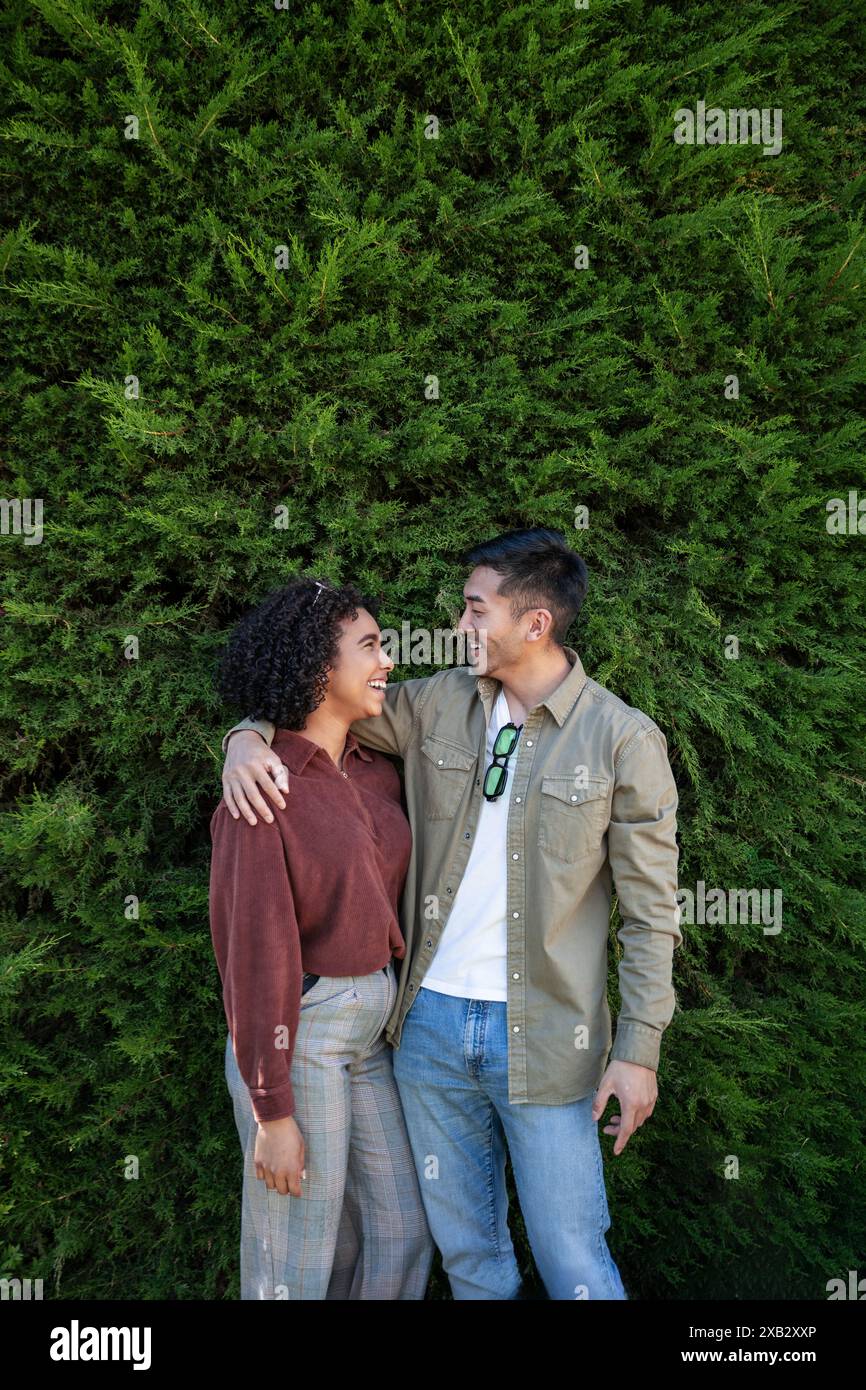 A multiethnic couple composed of a Chinese man and a Hispanic woman ...