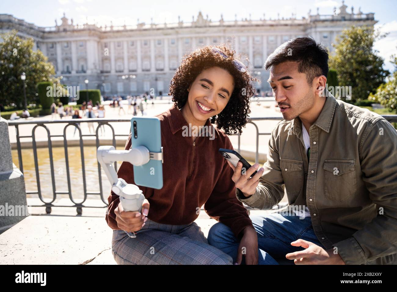 A multiethnic couple, a Chinese man, and a Hispanic woman, enjoy their ...