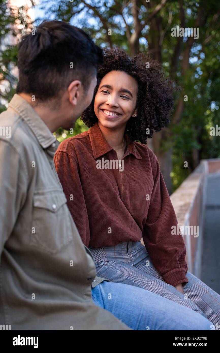 A multiethnic couple, a Chinese man and a Hispanic woman, share a ...