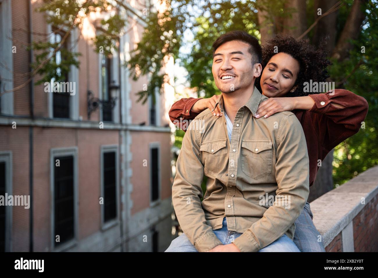 A multiethnic couple composed of a Chinese man and a Hispanic woman is ...