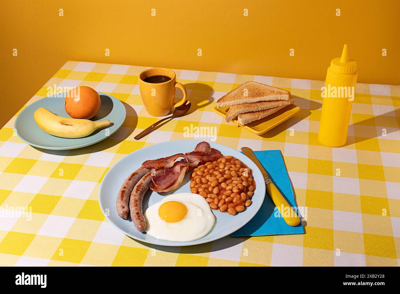 Yellow coloured Tablecloth with a delicious full English Breakfast, egg ...