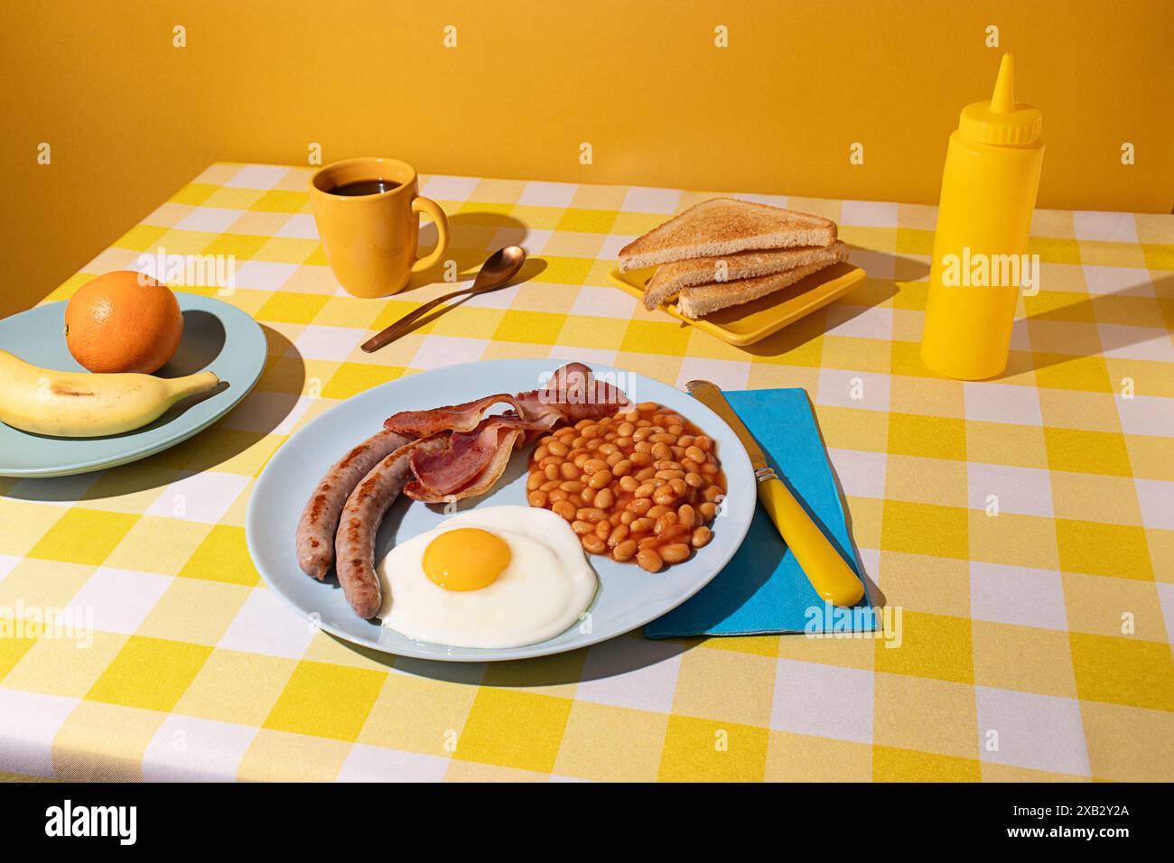 Yellow coloured Tablecloth with a delicious full English Breakfast, egg ...