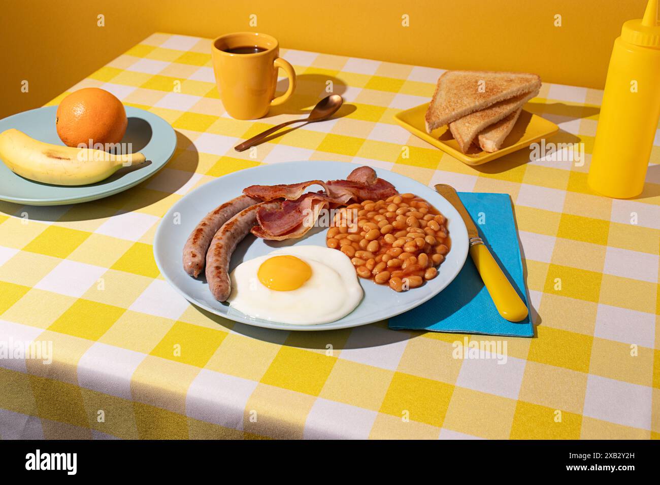 Yellow coloured Tablecloth with a delicious full English Breakfast, egg ...