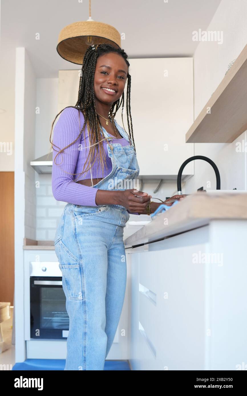 Young woman wearing denim overalls hi-res stock photography and images ...