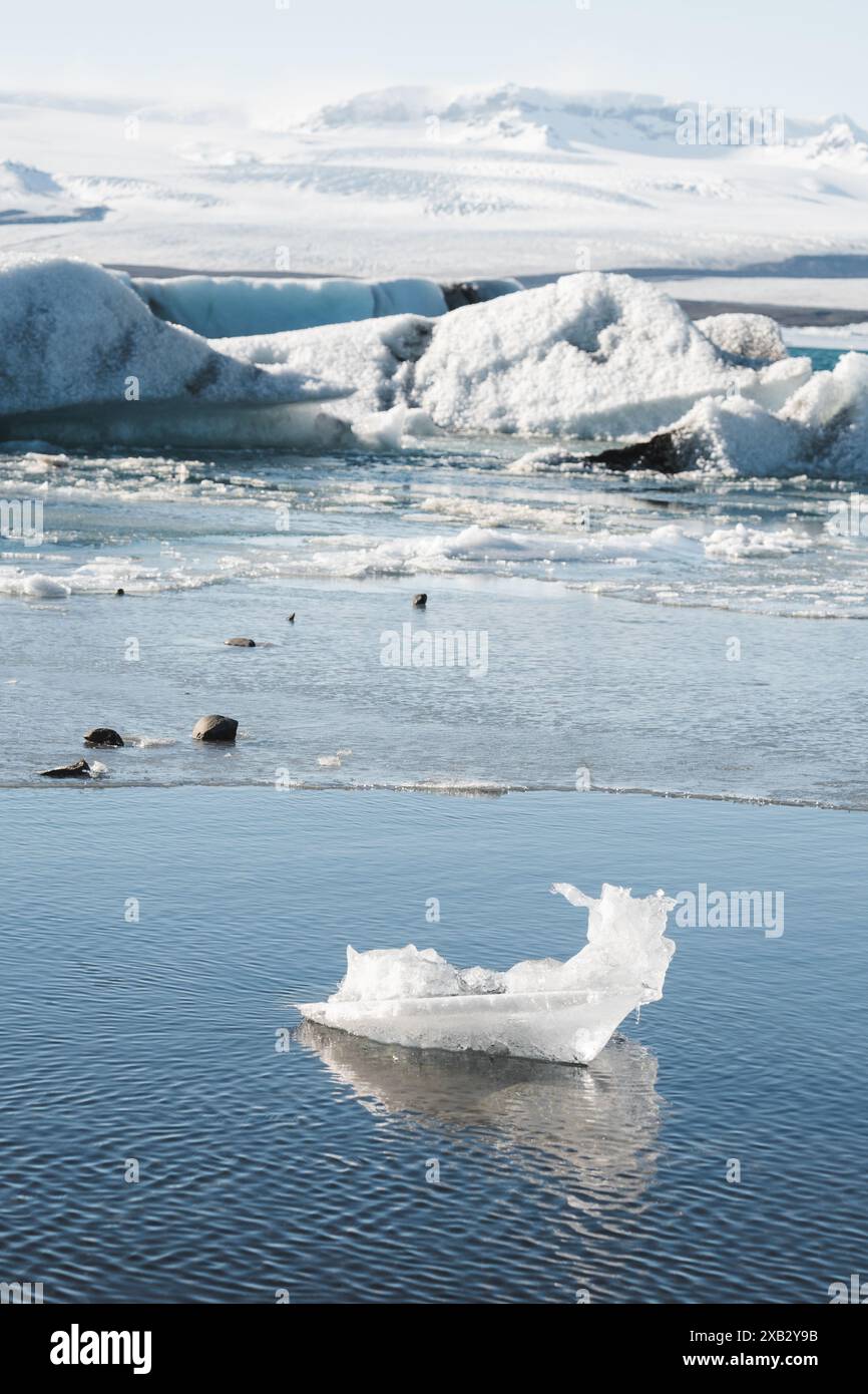 Tranquil Icelandic Waters with floating ice crisply highlighted against ...