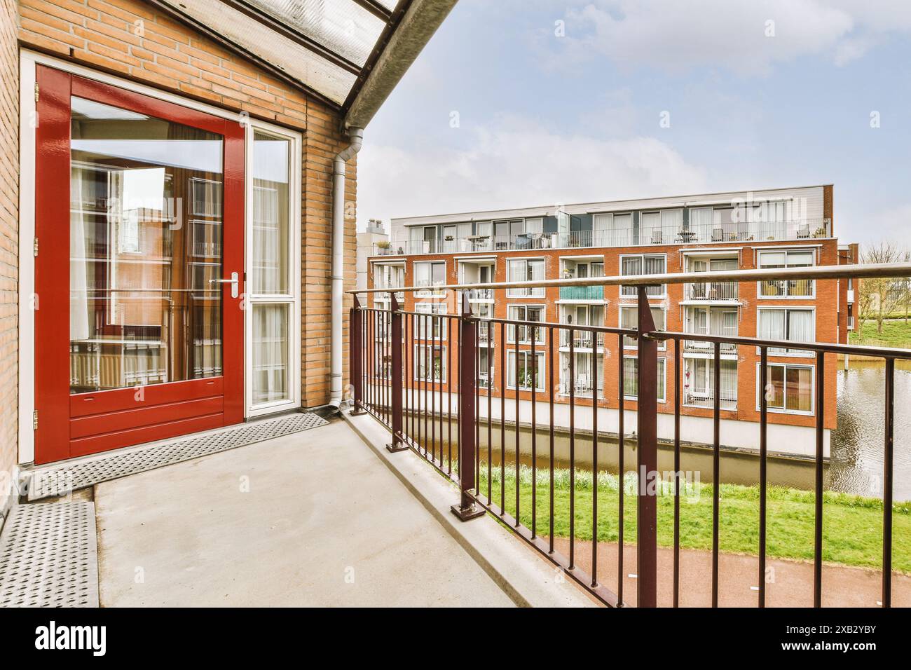 Contemporary balcony overlooking a serene canalside featuring modern ...