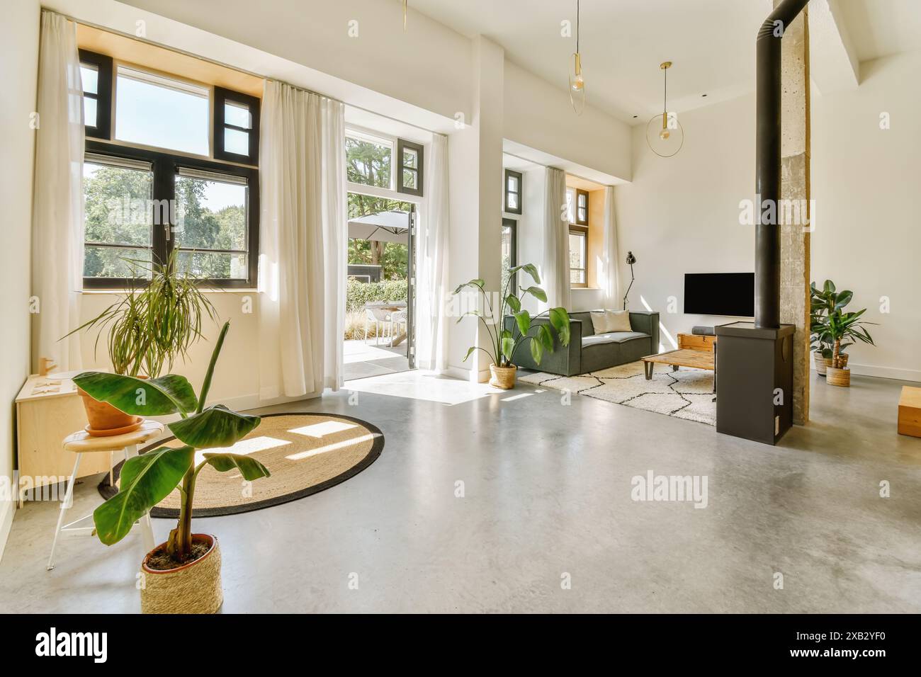 Spacious interior features high ceilings, large windows, and a mix of ...