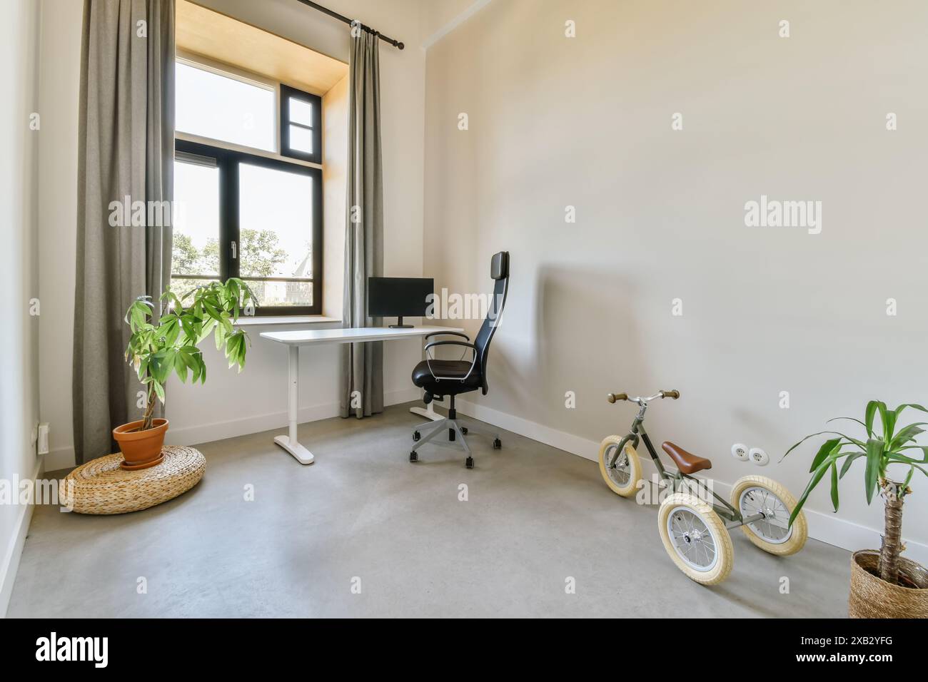 A contemporary home office setup featuring a sleek white desk ...