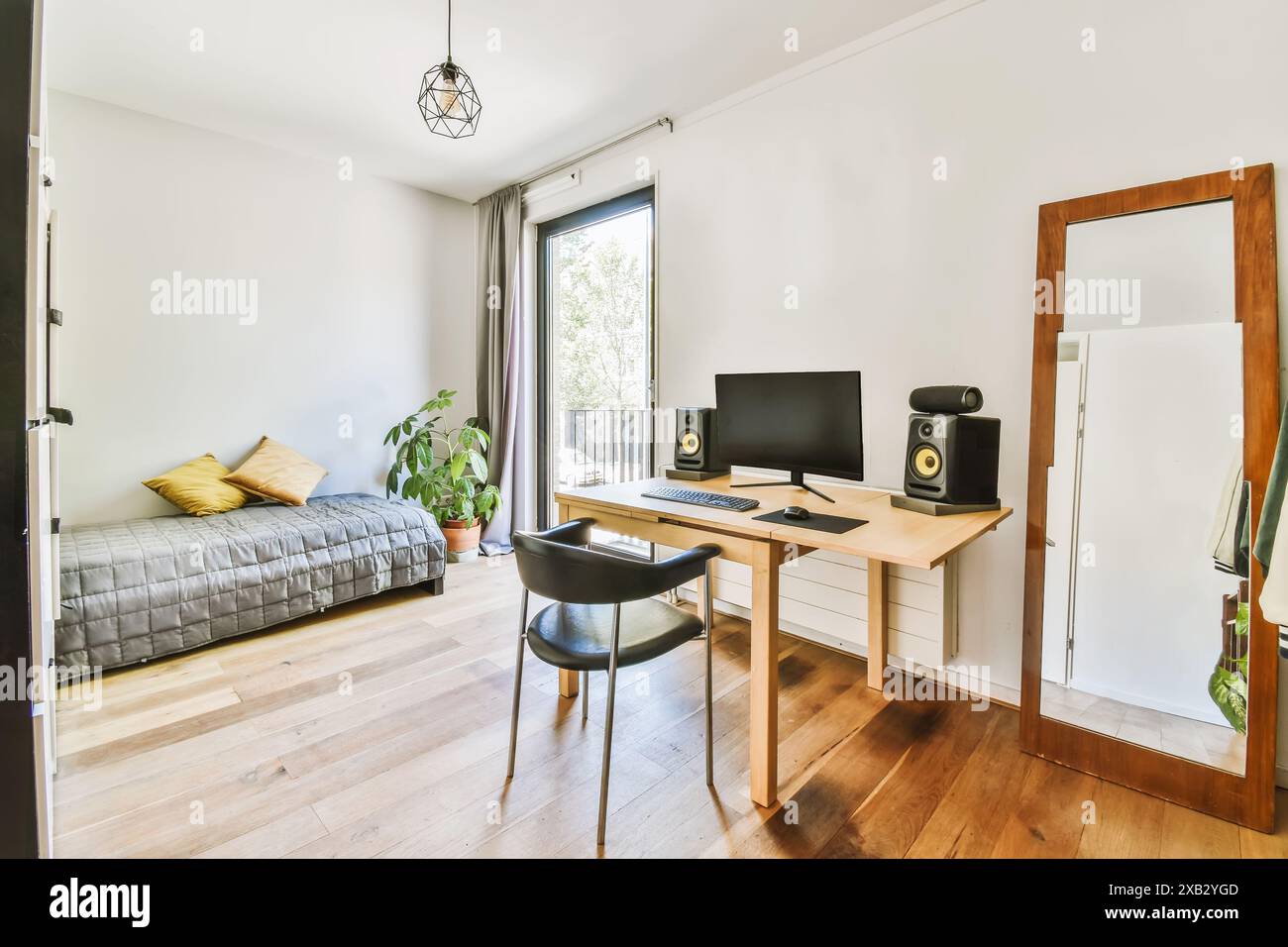 A chic, minimalist home office setup featuring a sleek desk with dual ...