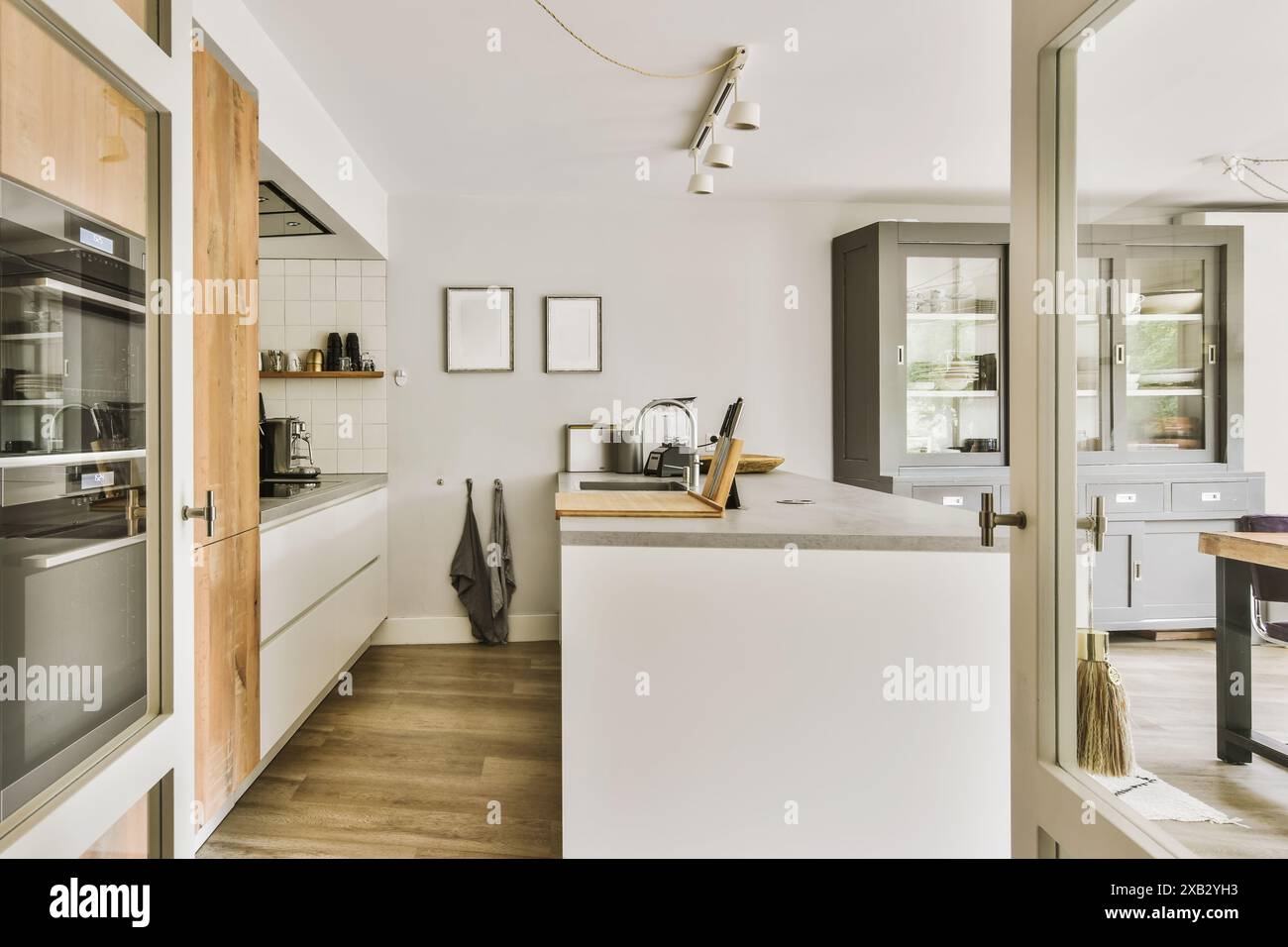 A contemporary kitchen space showcasing clean lines, wooden accents ...