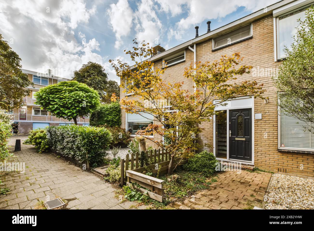 Charming brown brick house in Roggebotstraat, Amsterdam, accented with ...