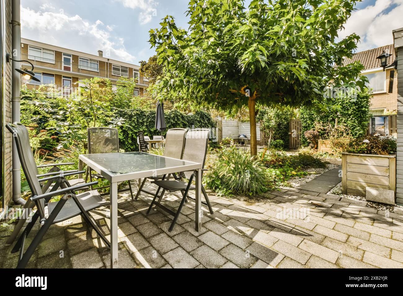 A tranquil outdoor dining area in Roggebotstraat, Amsterdam, featuring ...