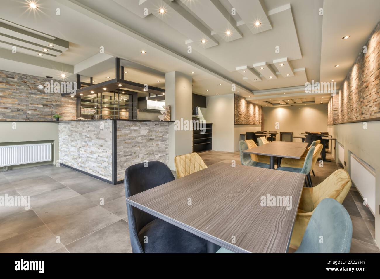 A stylish and contemporary cafe interior featuring clean lines ...