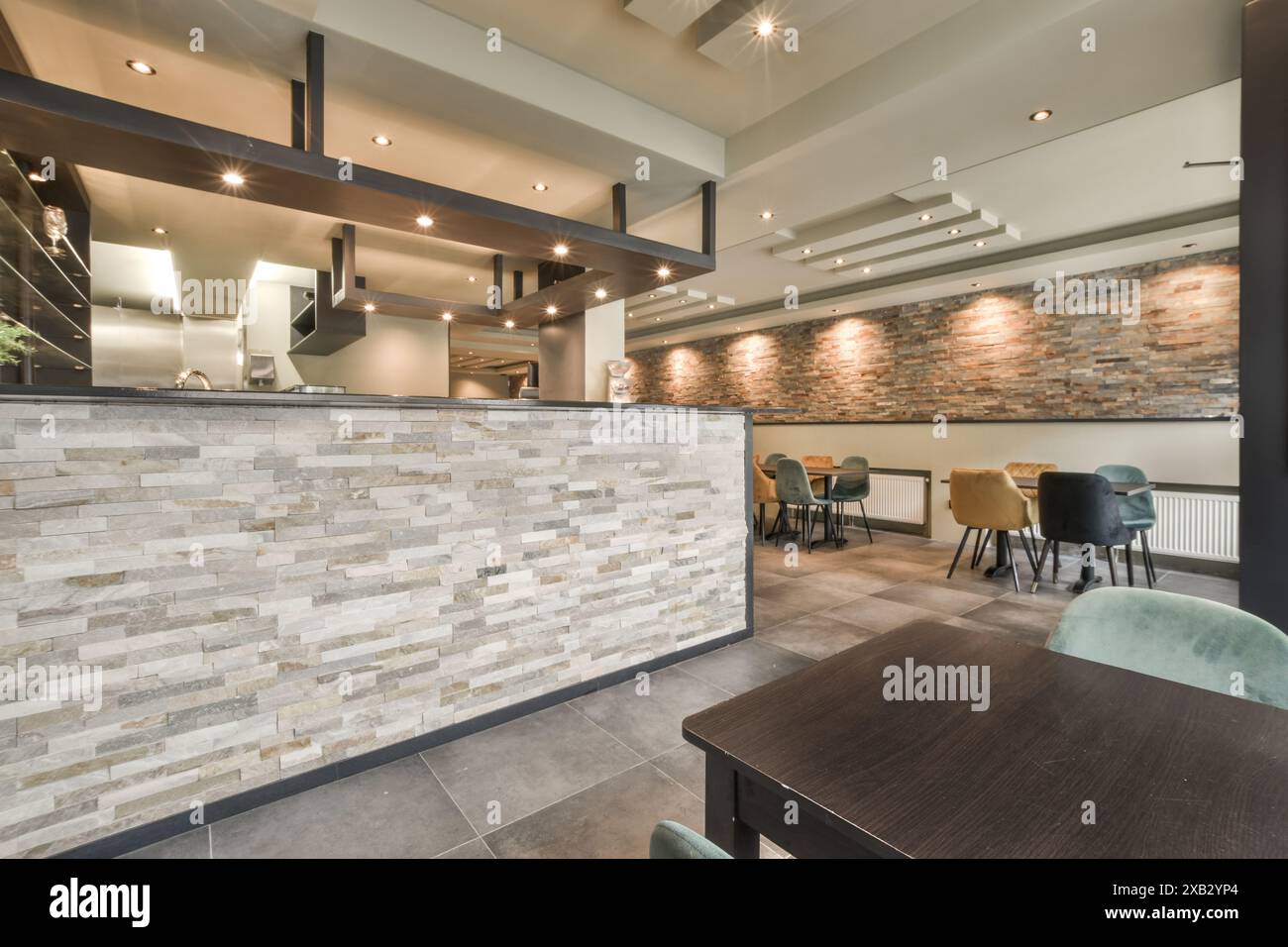 Contemporary restaurant interior with elegant stone accents and plush ...