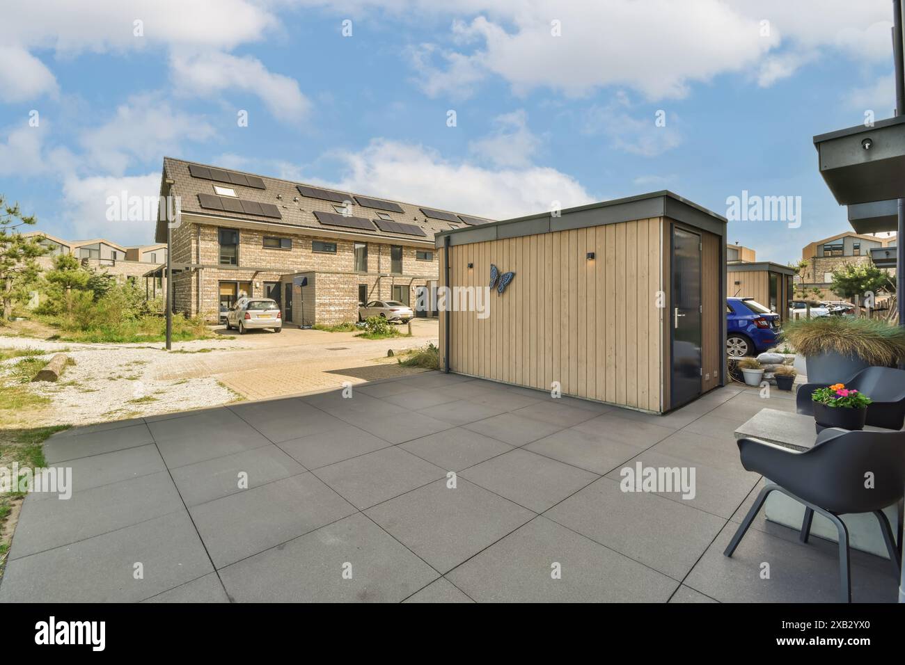 Contemporary townhouses line the street of Duintopstraat , featuring ...