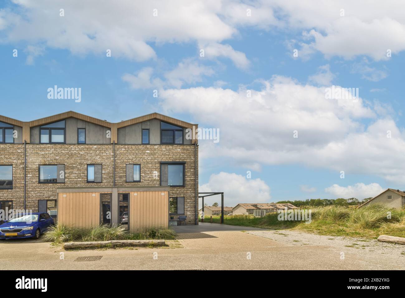 A contemporary residential building located at Duintopstraat features ...