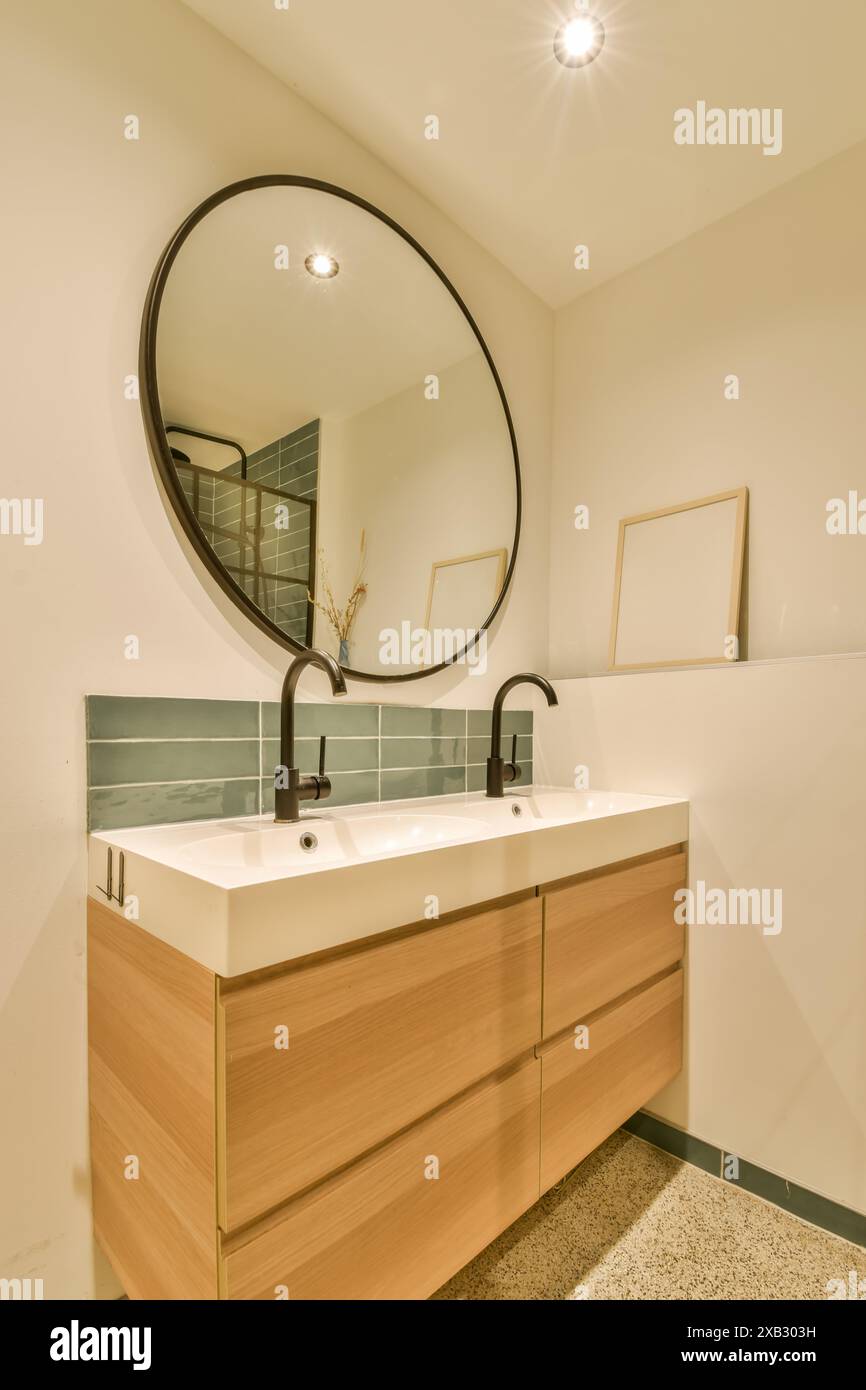 An elegantly simple bathroom interior featuring a modern vanity with ...