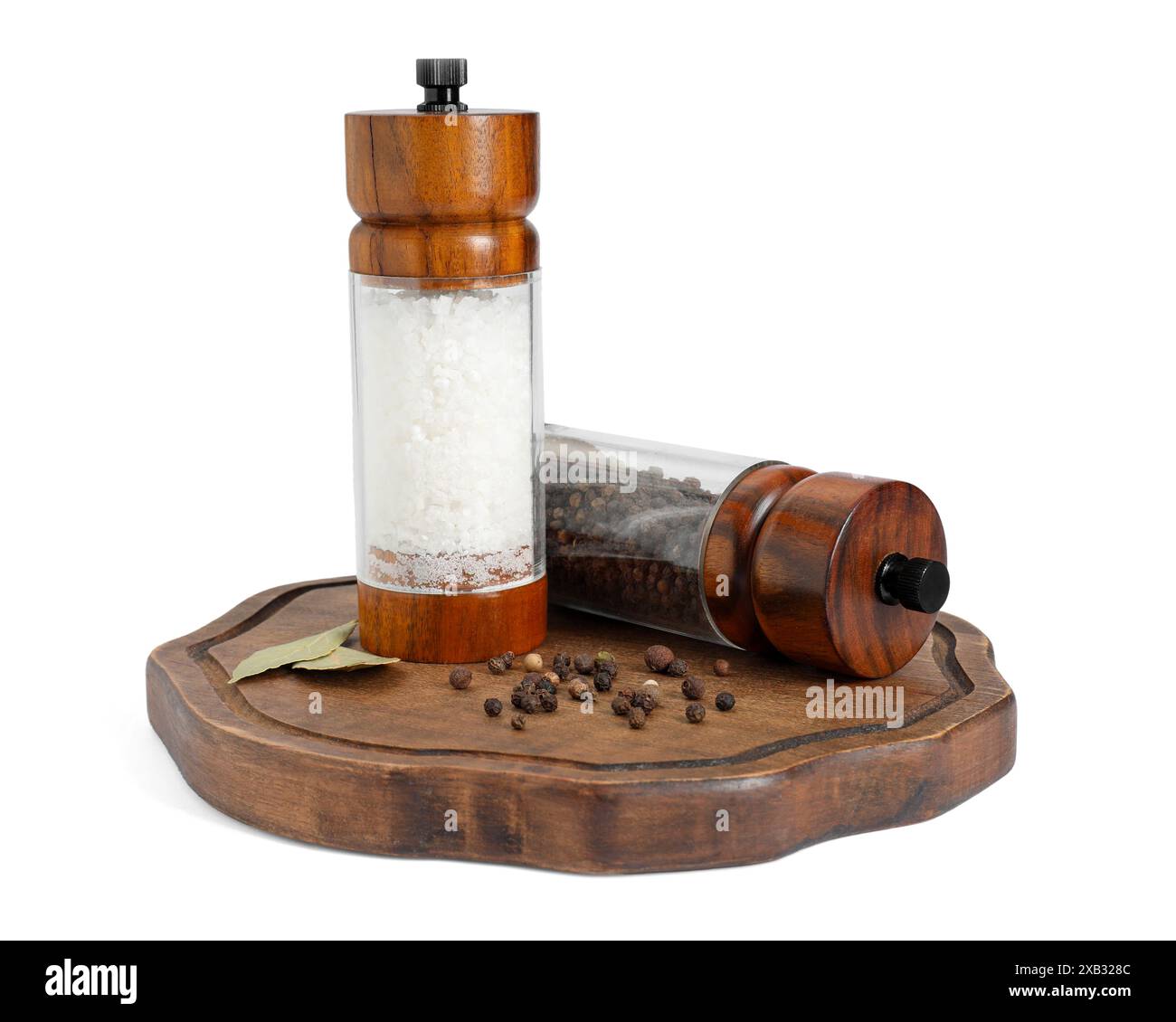 Salt and pepper shakers with bay leaves isolated on white Stock Photo ...