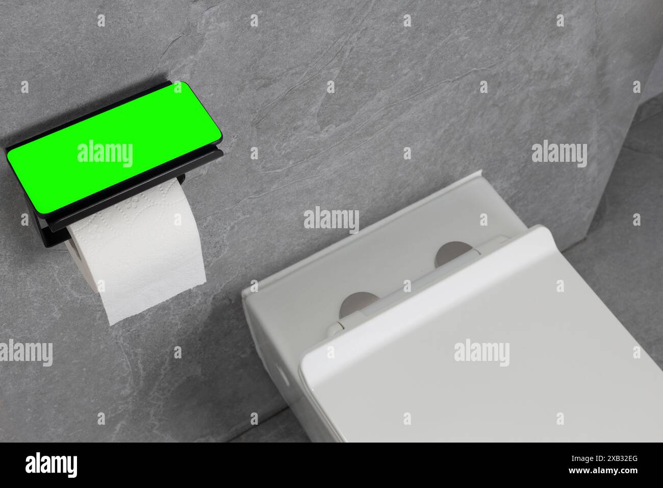 Smartphone Holder with Toilet Paper Roll Stock Photo - Alamy