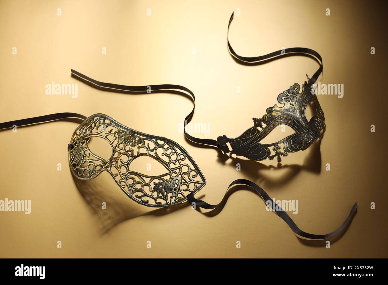 Elegant face masks on beige background. Theatrical performance Stock ...