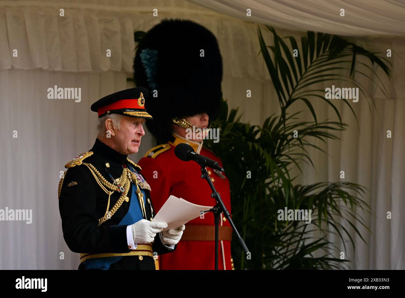 King Charles III, Colonel-in-Chief of the Household Division, presents ...