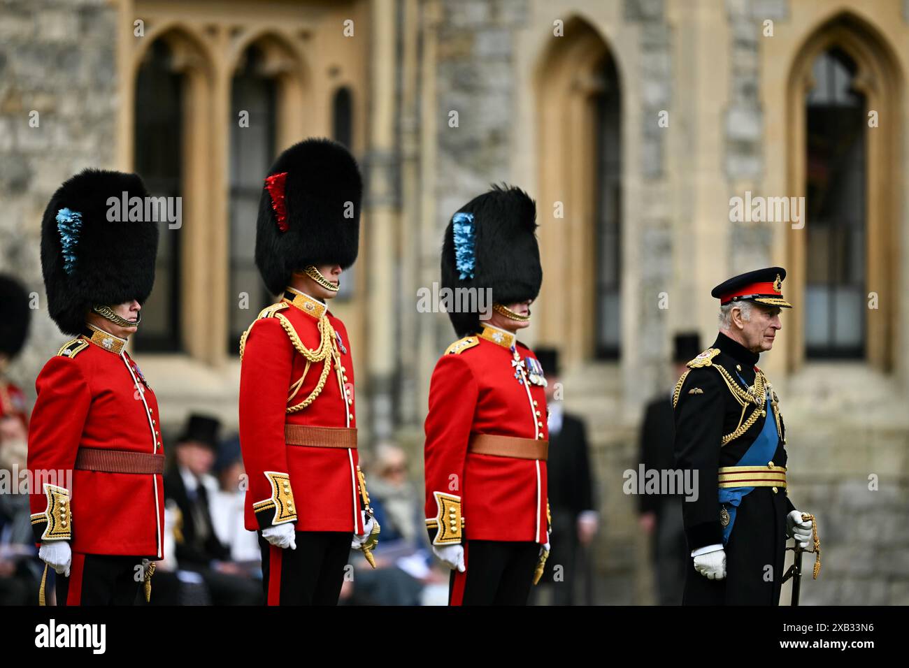 King Charles III, Colonel-in-Chief of the Household Division, presents ...