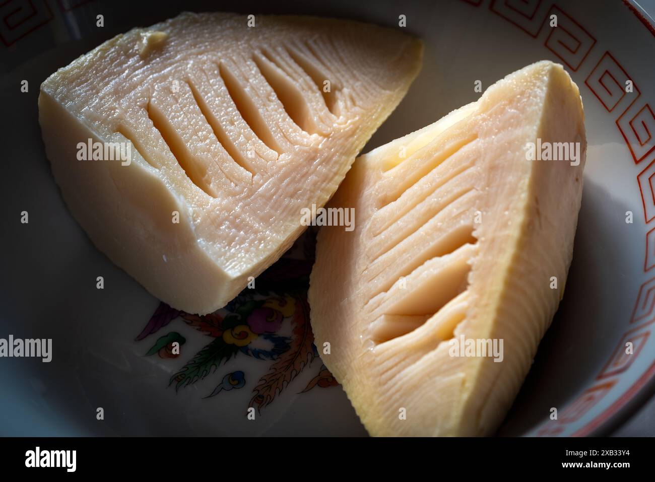 Boiled bamboo shoot cut in half in a bowl Stock Photo - Alamy