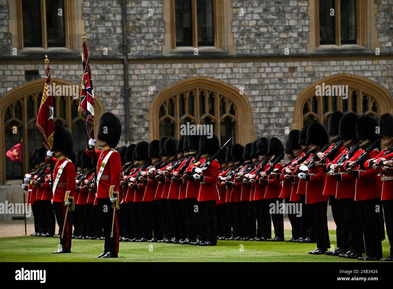 Soldiers from the Irish Guards stand guard with their New Colours ...