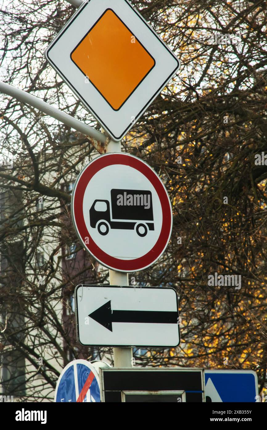The sign features a truck in the center. It includes motifs like Motor ...