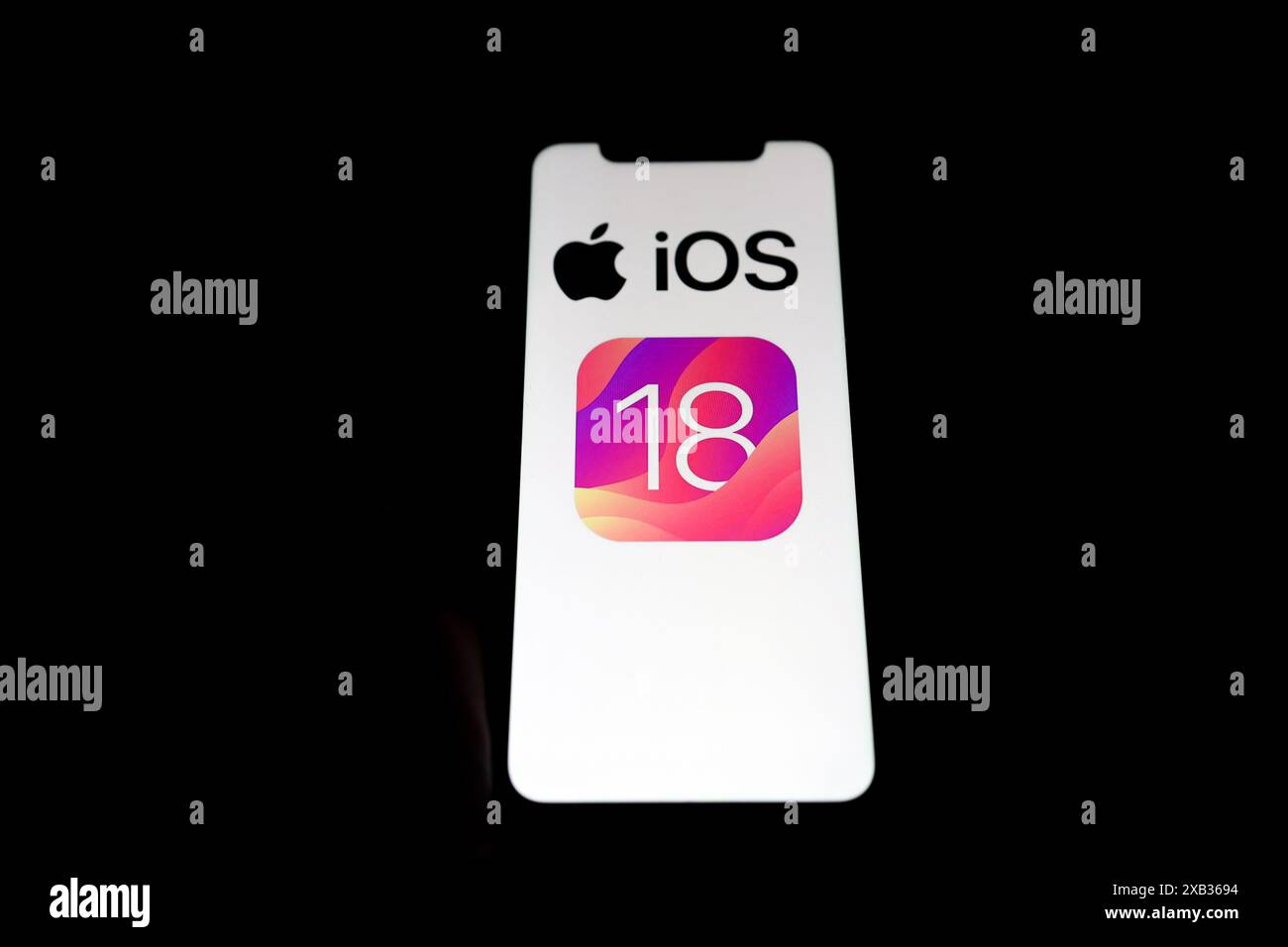 In this photo illustration a Apple iOS 18 logo seen displayed on an ...