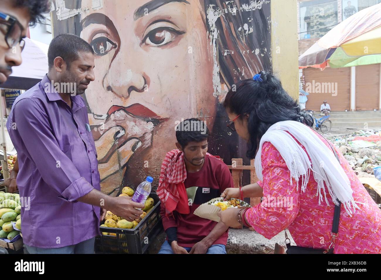 People get food from a social worker on World Food Safety Day ...