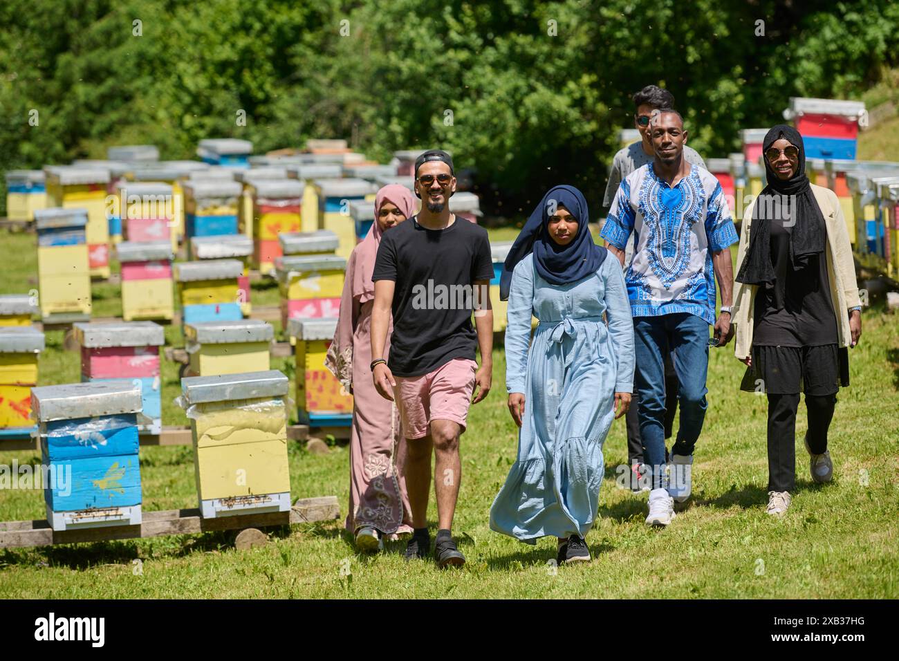 A diverse group of young friends and entrepreneurs explore small honey ...