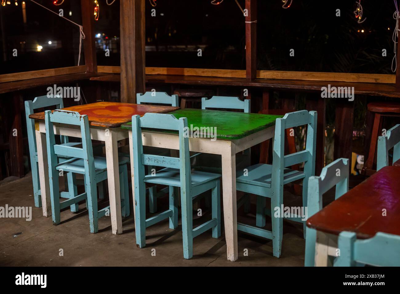 Quaint restaurant with rustic tables and chairs, El Tunco, surf town in ...