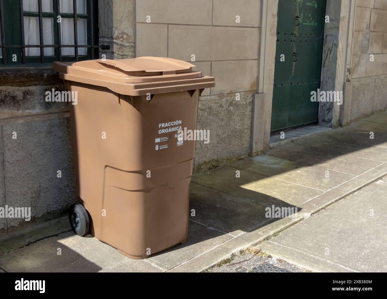CASTROPOL, SPAIN - JUNE 02, 2024:Brown organic waste bin in Castropol ...