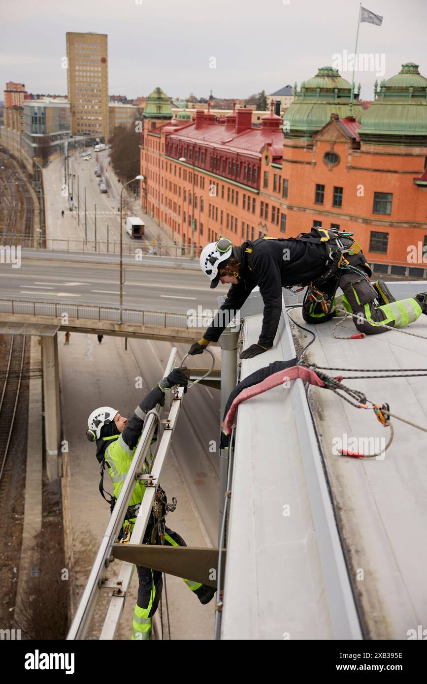 Helping colleague hi-res stock photography and images - Alamy