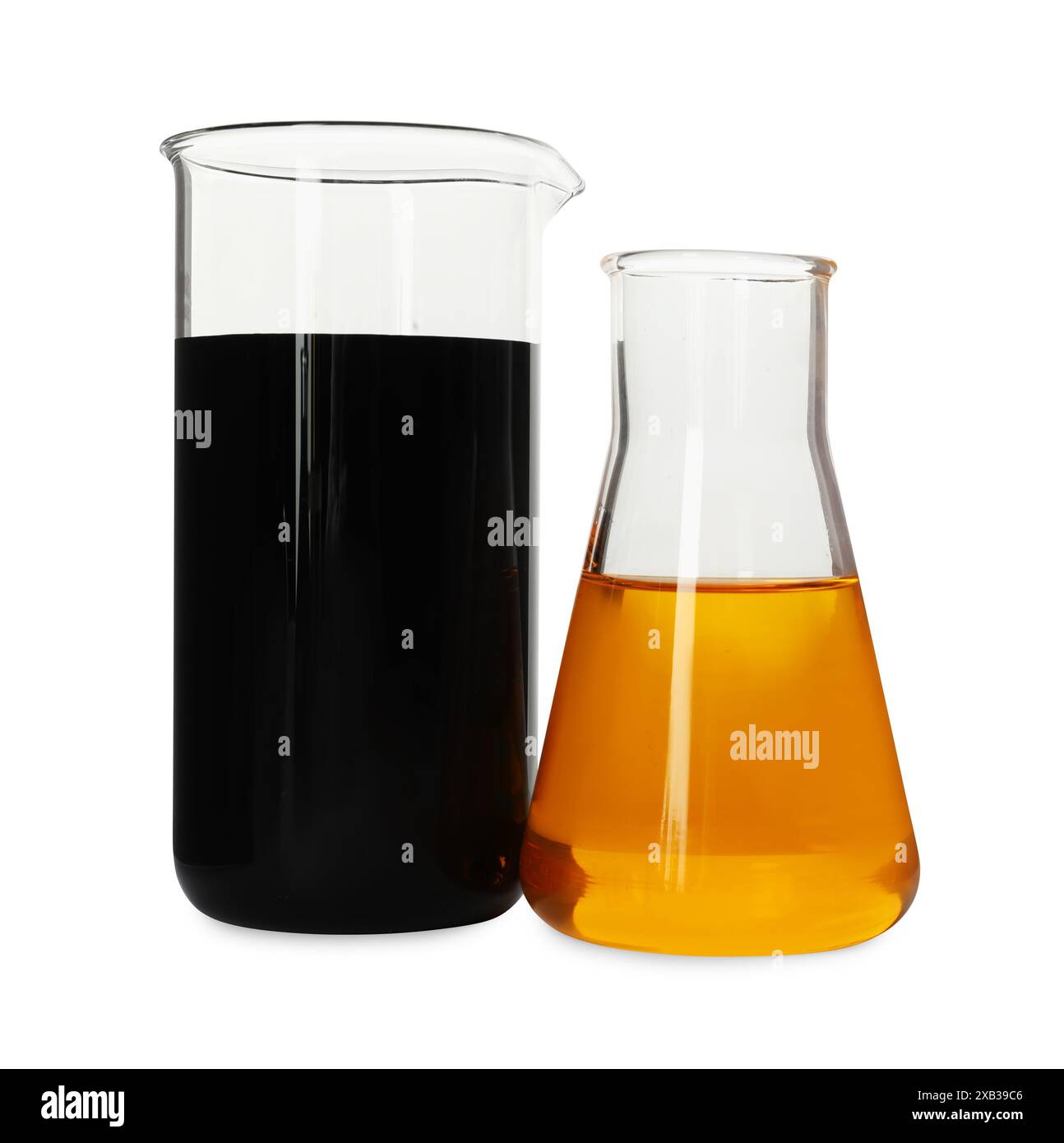 Beaker and flask with different types of oil isolated on white Stock ...