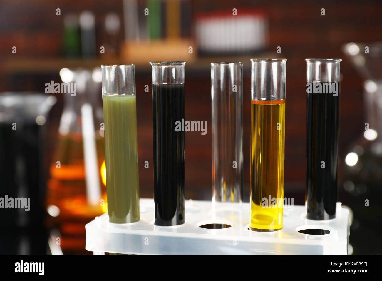 Test tubes with different types of oil in rack, closeup Stock Photo - Alamy
