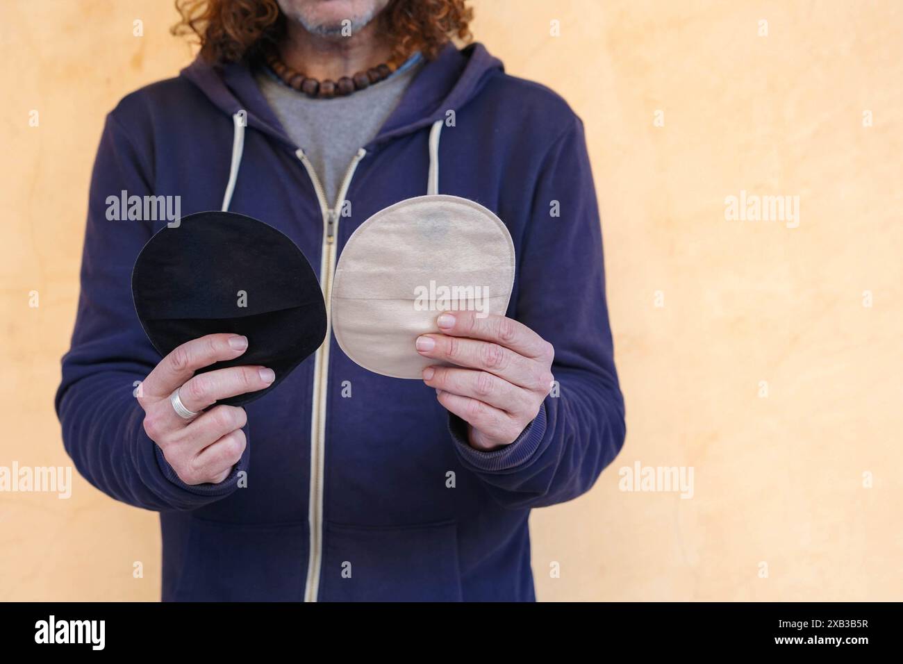 unrecognizable man showing ostomy bags. World Colon Cancer Day ...