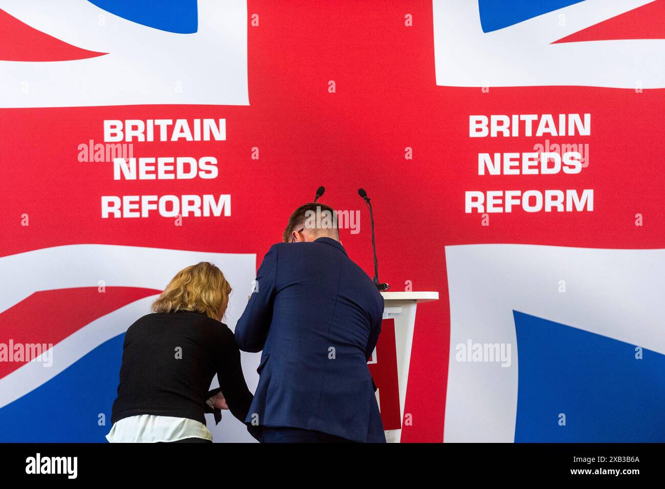 London, UK. 10 June 2024. Staff prepare the lectern as the Reform UK ...