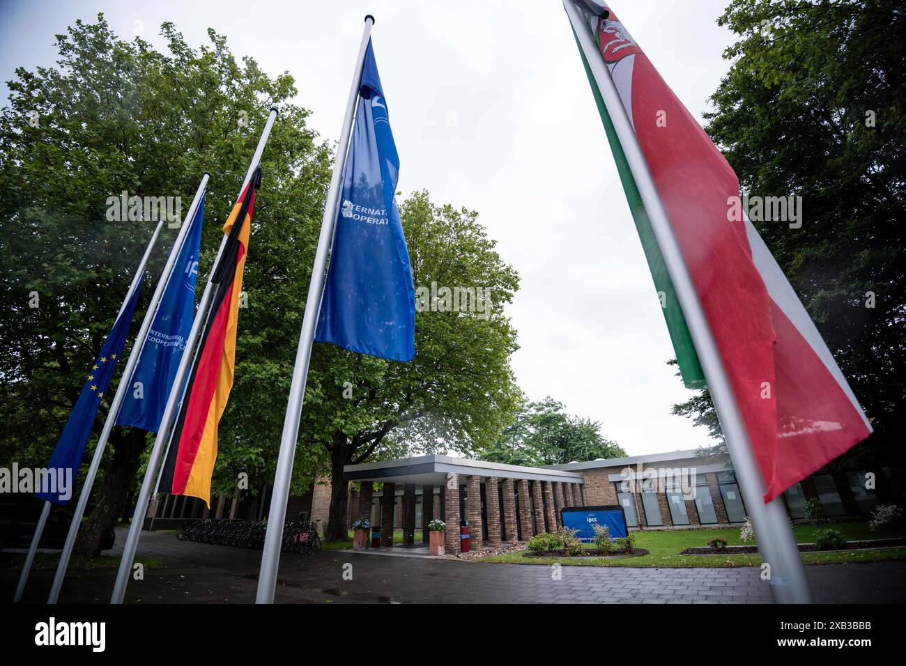 Neuss, Germany. 10th June, 2024. Flags fly in front of the entrance to ...
