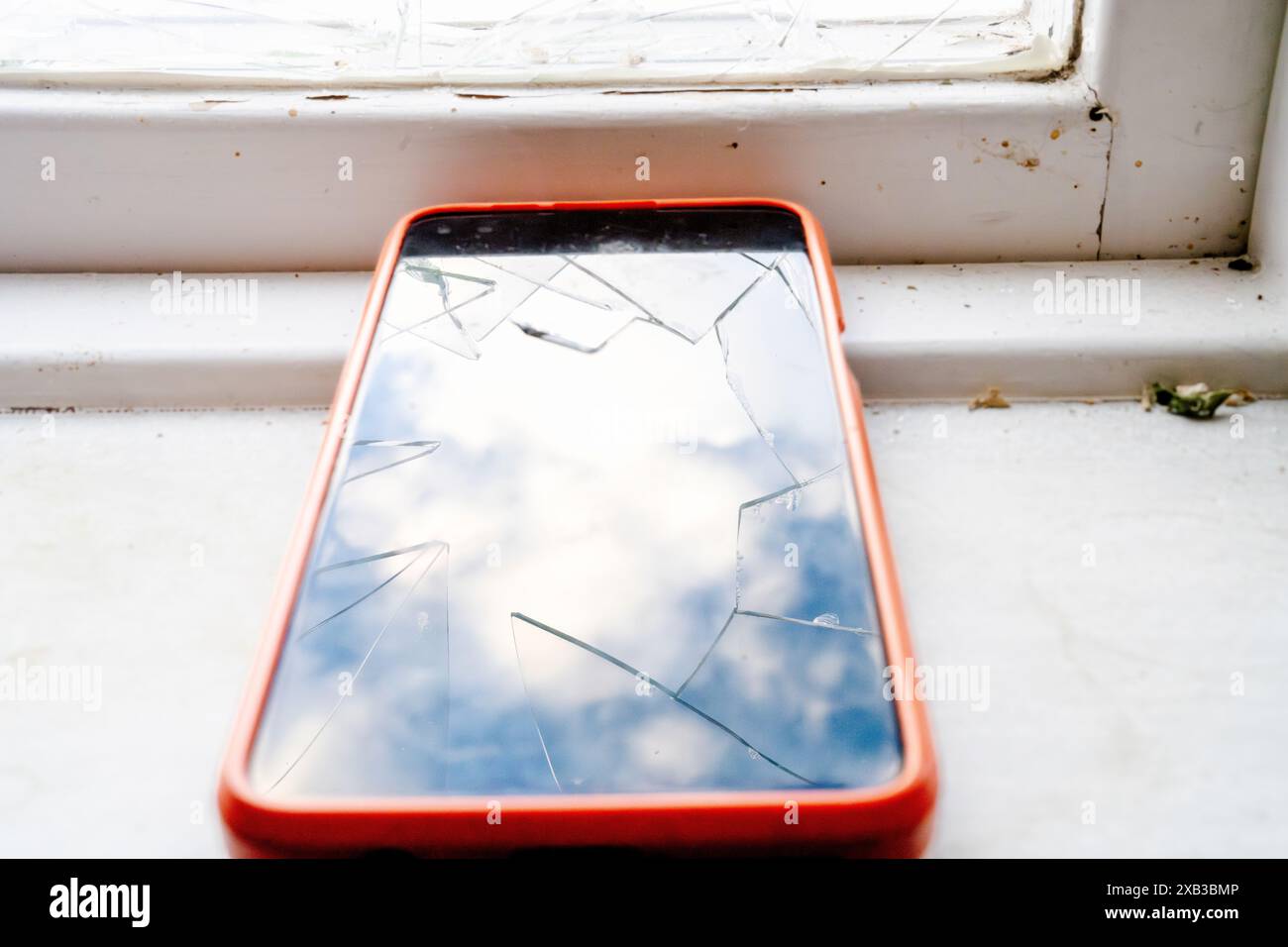 Close-up of broken touchscreen of smart phone on window sill Stock ...