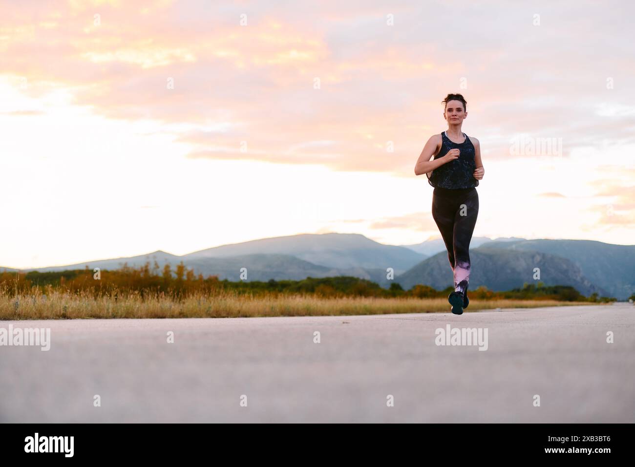 Determined Athlete Running in the Sun amidst Beautiful Nature Stock ...