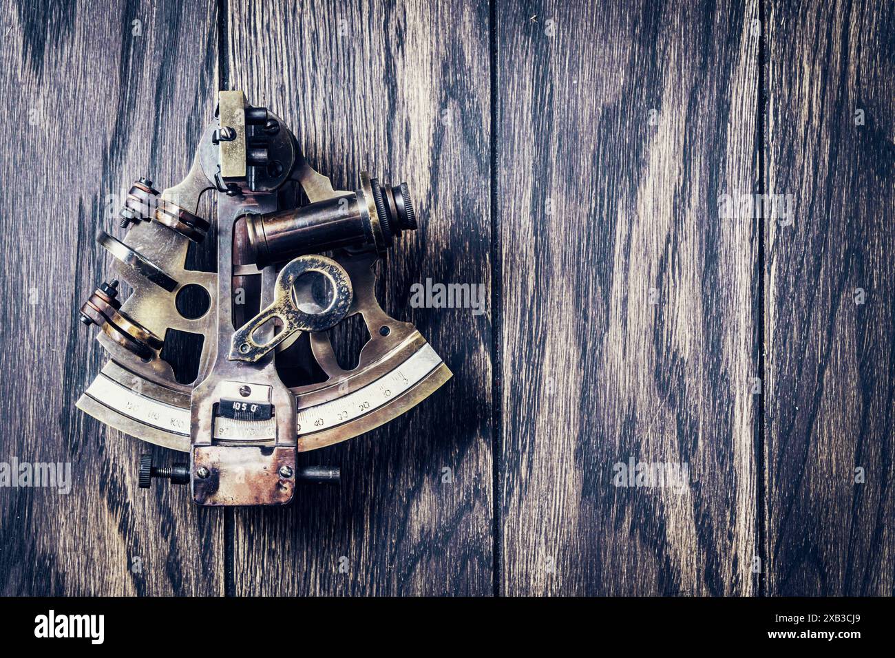 Old sextant on oak wooden table top view with copy space Stock Photo ...