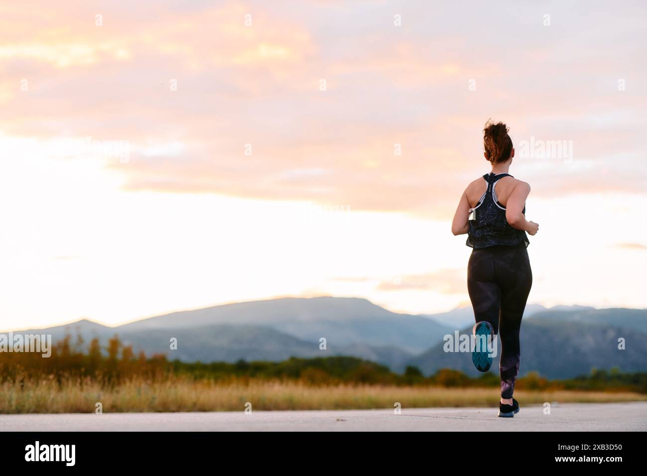 Determined Athlete Running in the Sun amidst Beautiful Nature Stock ...